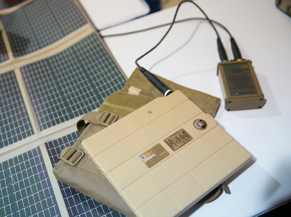 Firm Combines Battery and Armor Plate For Troops