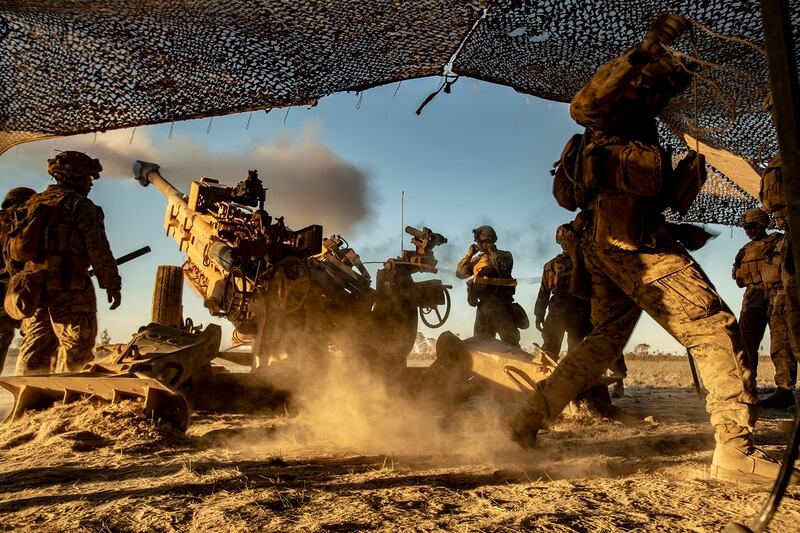 Two female Marine cannoneers are now howitzer section chiefs