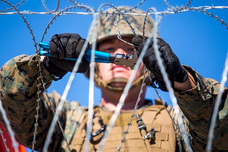 Razor wire is most visible result of $210M troop deployment to the US ...