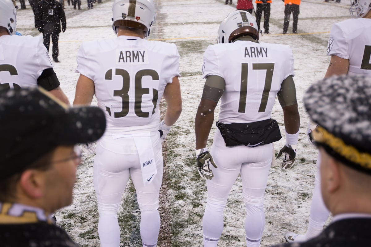 ‘Bigger than a game’: Army and Navy unite to support coach’s son
