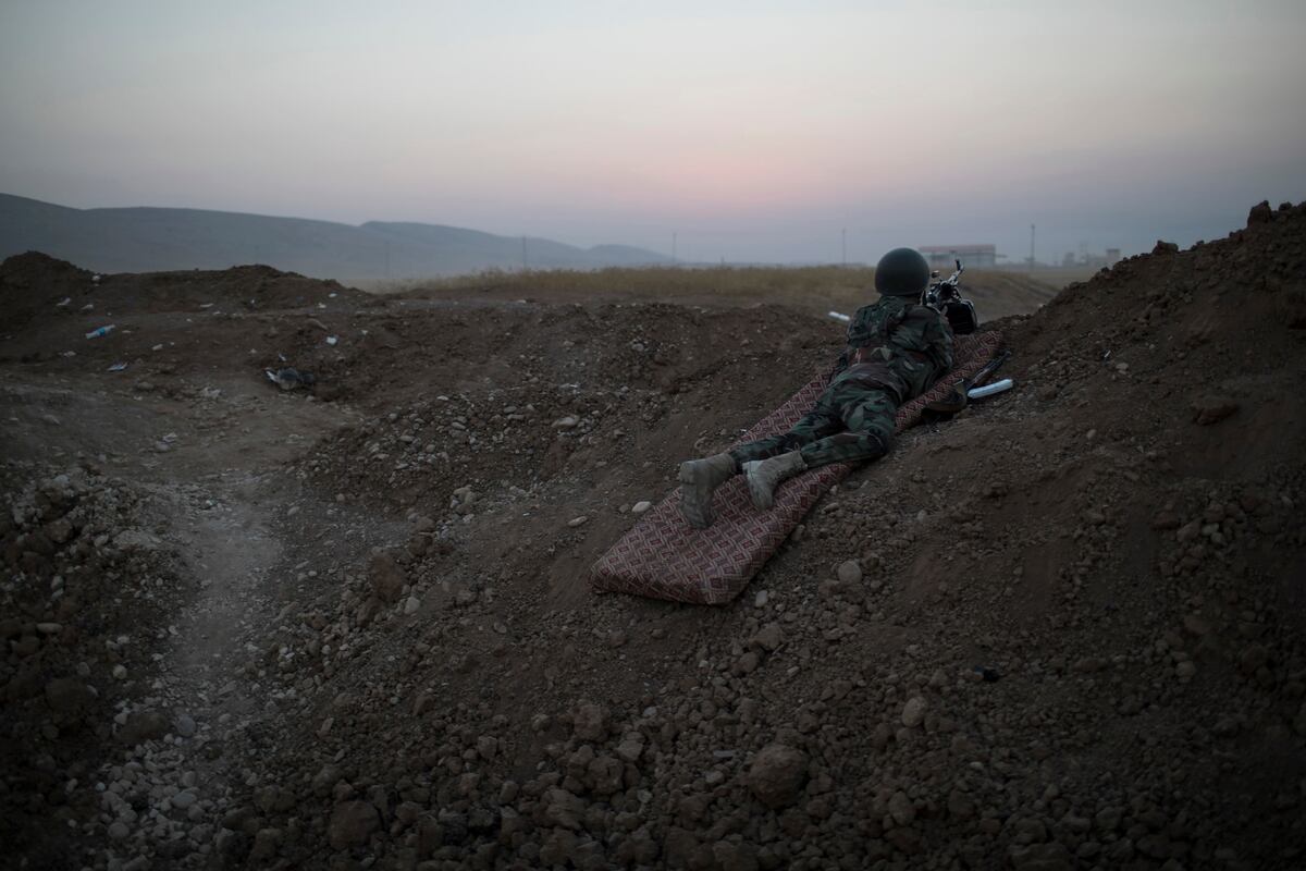 Iraqi Kurdish forces advance as mass grave found near Mosul