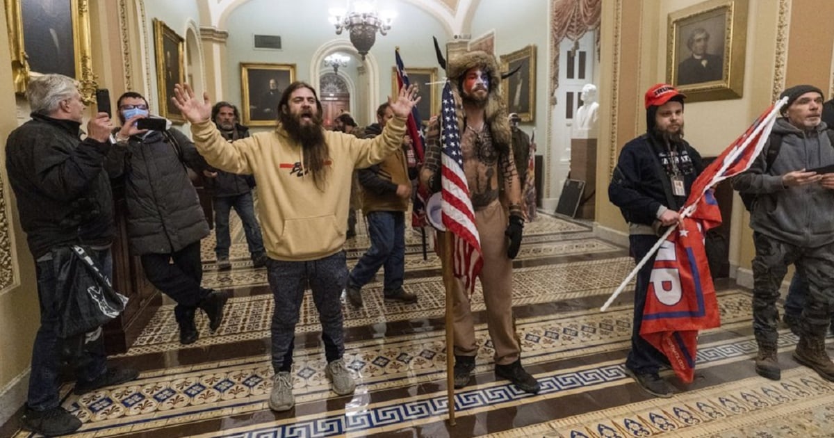 ‘QAnon Shaman’ charged with storming the Capitol is a Navy veteran