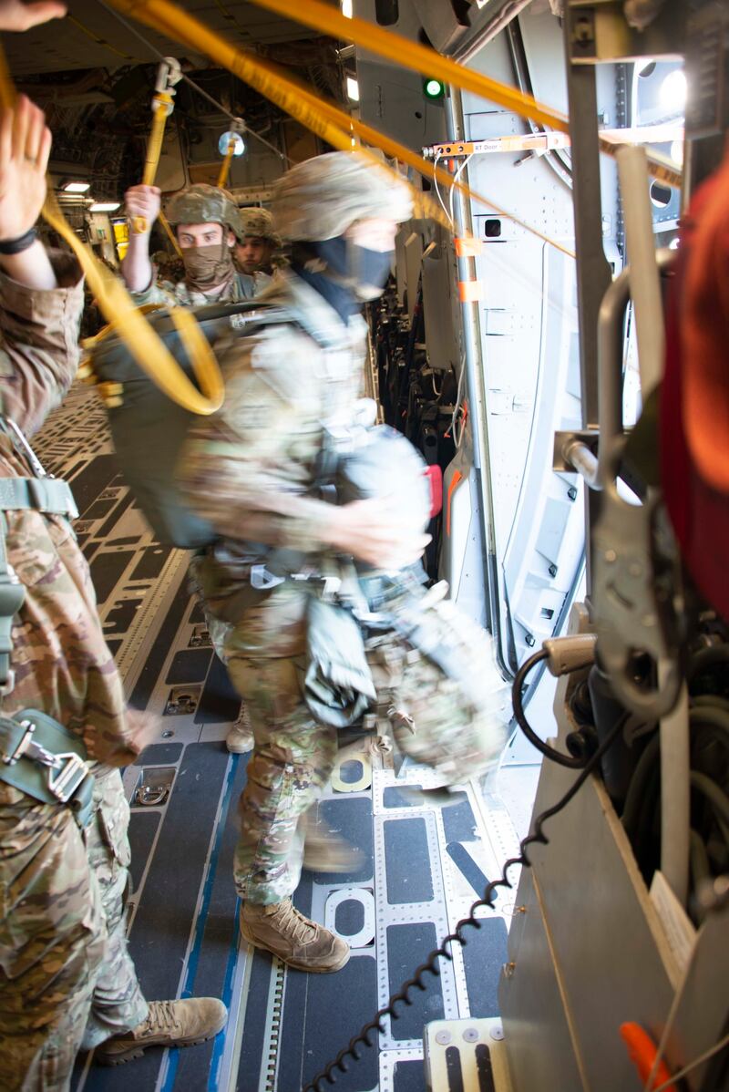 Paratroopers use mouth guard to stress-test helmet protection during jumps