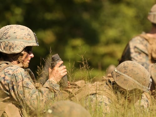 Two female Marine cannoneers are now howitzer section chiefs